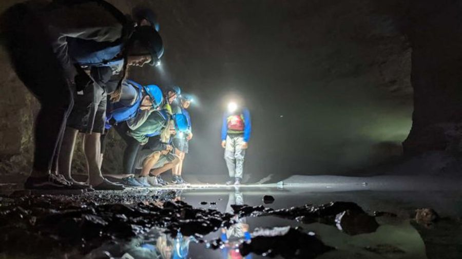 This Glass-Bottomed Kayak Tour Brings You To An Underground Waterfall