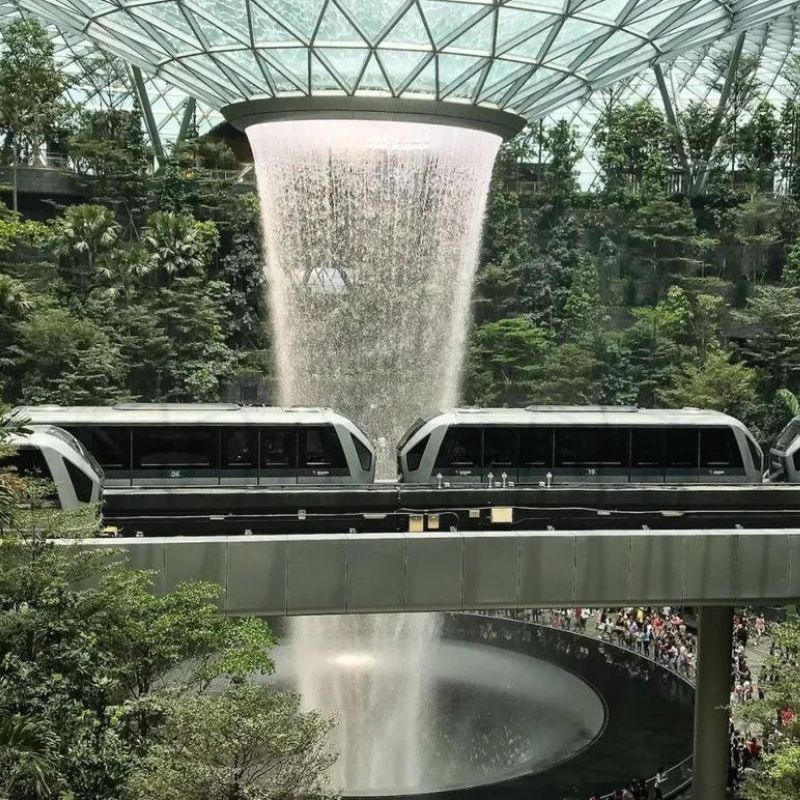 Changi Airport T2 Reopens With A 4-Storey Waterfall, Robot Bartender