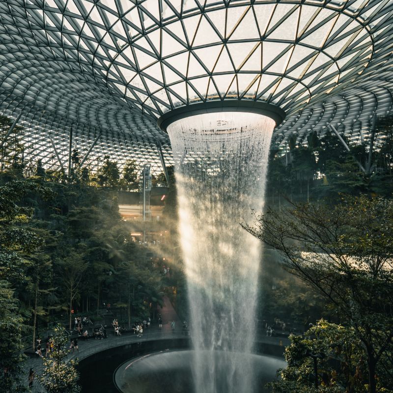 Changi Airport T2 Reopens With A 4-Storey Waterfall, Robot Bartender